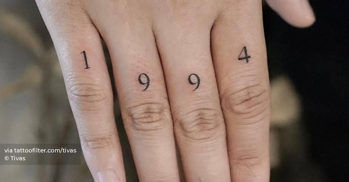 "1994" tattoo located on the knuckles.