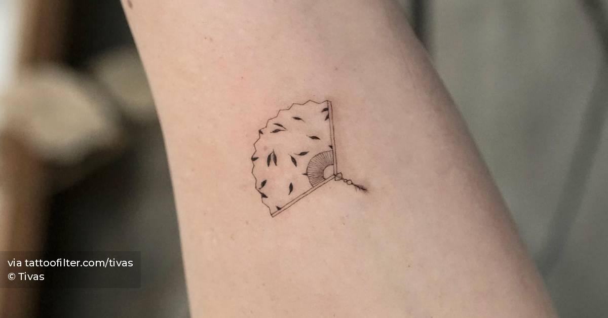 Little hand fan tattoo located on the inner forearm.