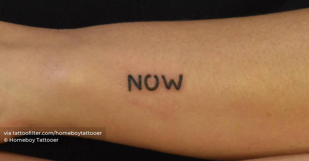 Tattoo of the word "now" located on the wrist.