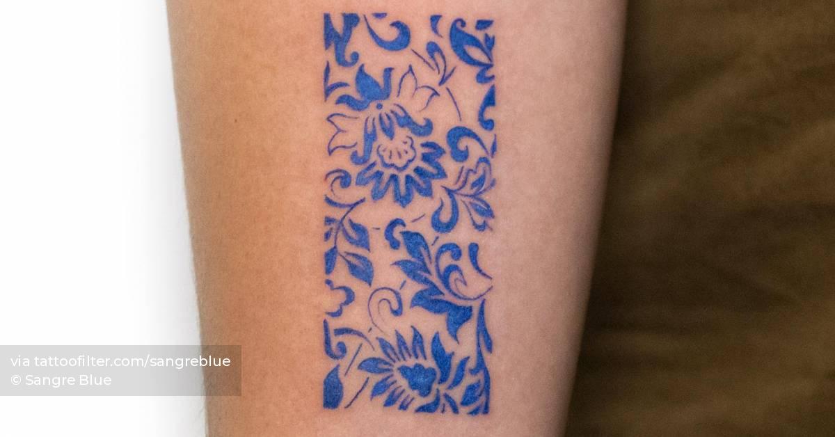 Porcelain rectangle tattoo located on the inner