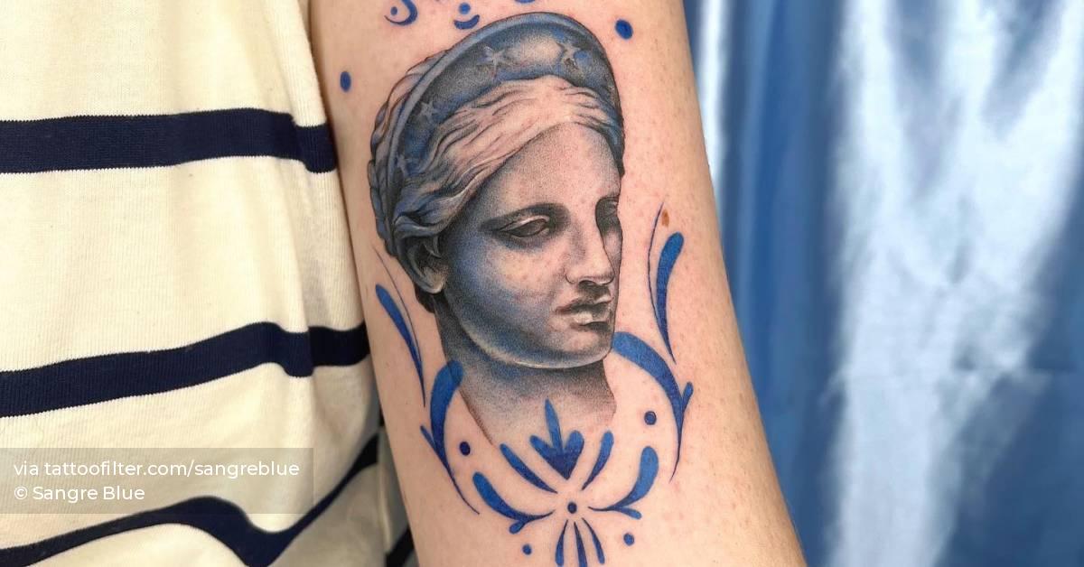 Goddess Juno tattooed on the bicep.