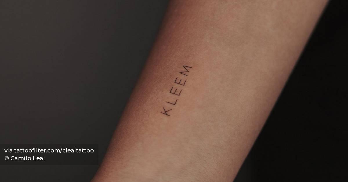 Tattoo of the word "kleem" placed on the wrist.
