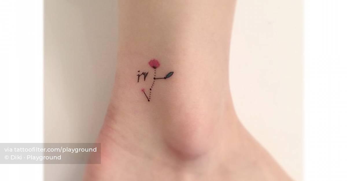 Minimalistic virgo flower and initials tattoo located