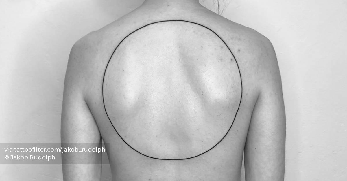 Huge circle tattoo located on the back, minimalistic