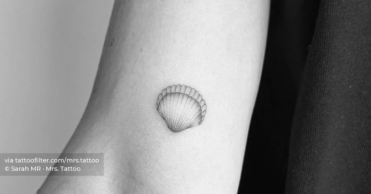 Illustrative style shell tattoo placed on the inner