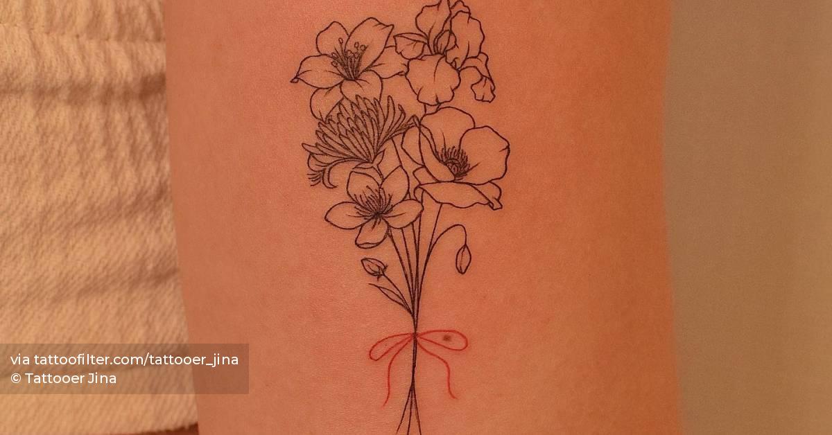 Fine line style flower bouquet tattoo placed on the