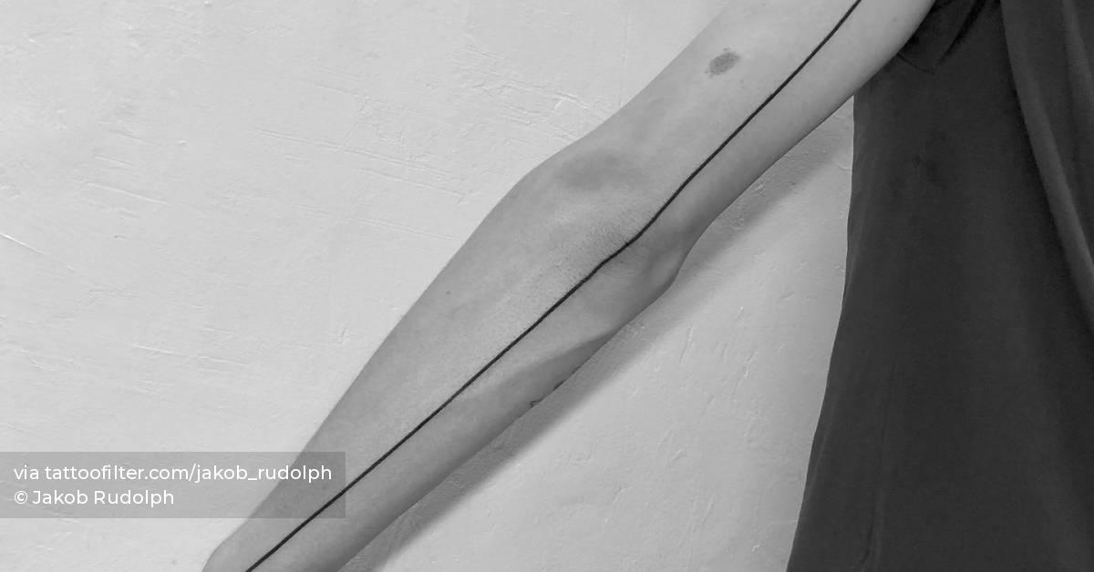 Huge line tattoo located on the arm.