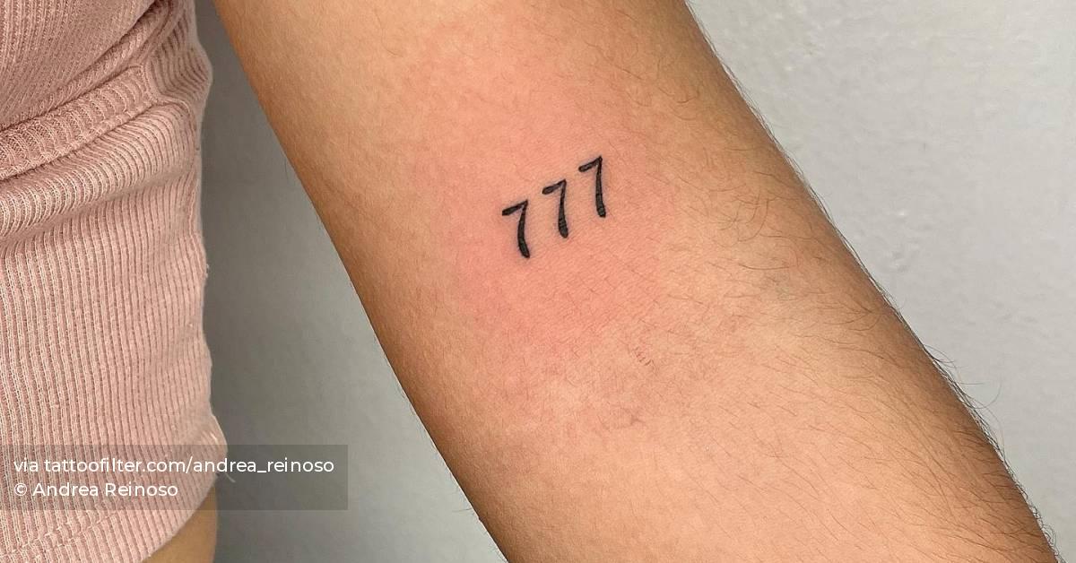 Tattoo of the number "777" located on the bicep.
