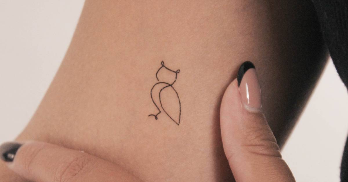 Single line owl temporary tattoo located on the inner
