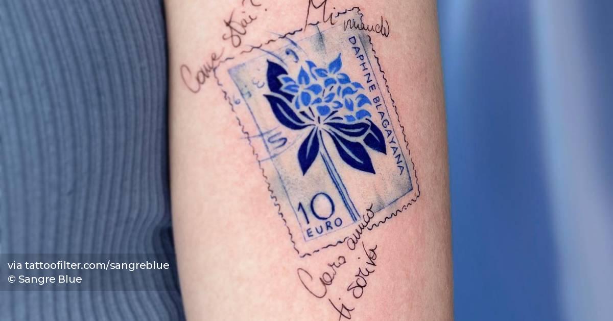 Daphne blagayana stamp tattooed on the upper arm.