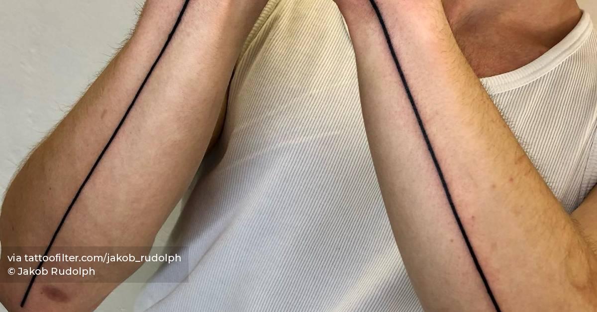 Individual matching line tattoo located on the forearm.