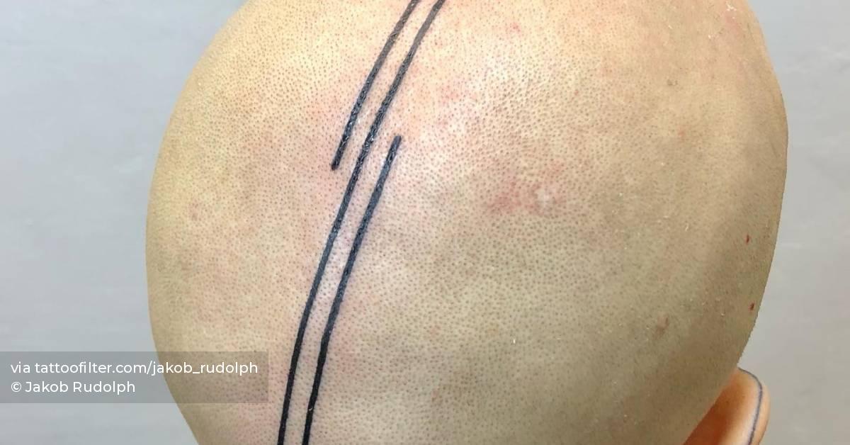 Lines tattoo located on the head, minimalistic style.