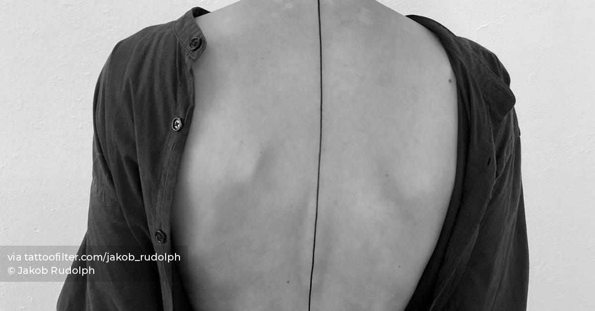 Huge line tattoo located on the spine and neck.