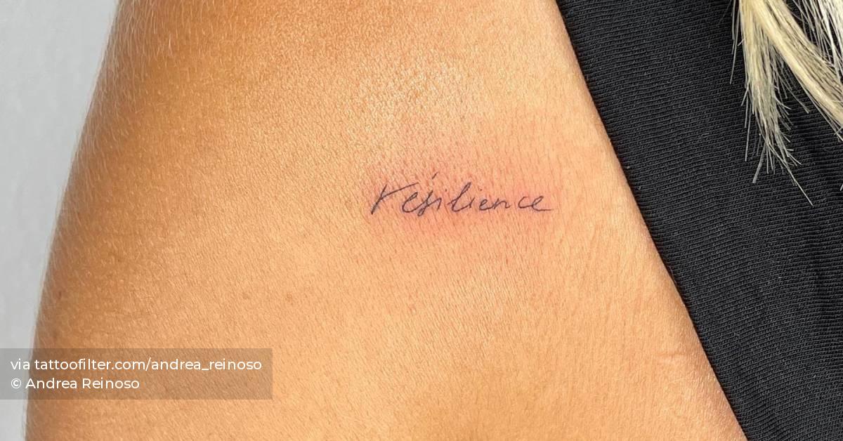 Tattoo of the word "resilience" handwritten on the
