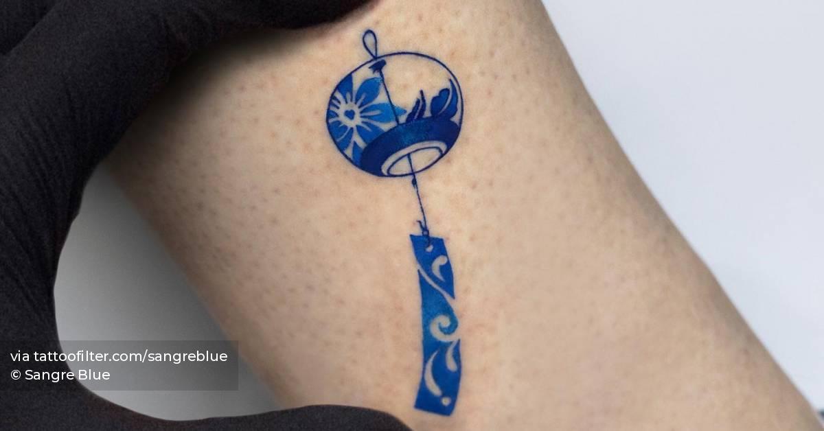 Porcelain japanese wind chime tattoo located on the