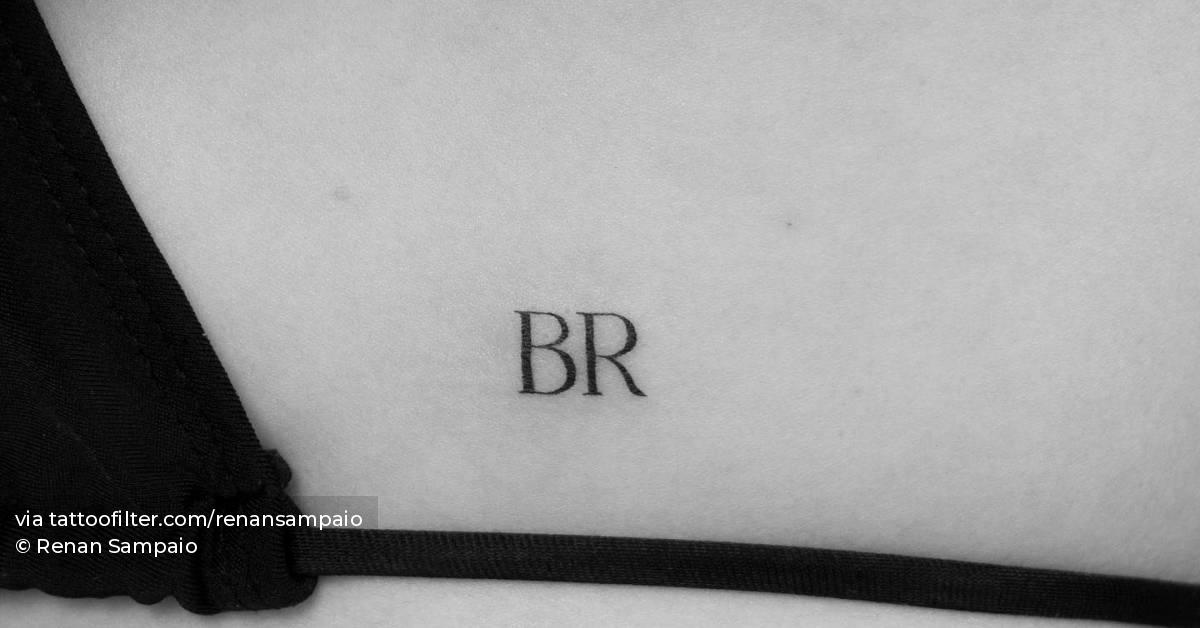 Initials "BR" tattoo located on the side boob.