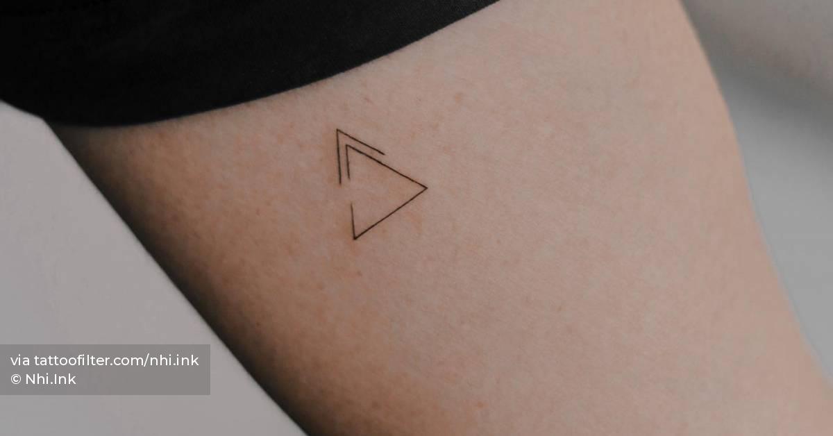 Minimalistic style open to change symbol tattooed on