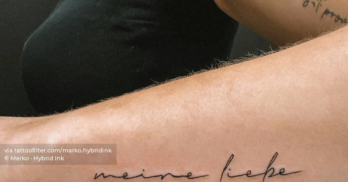 "Meine liebe" lettering tattoo handwritten on the