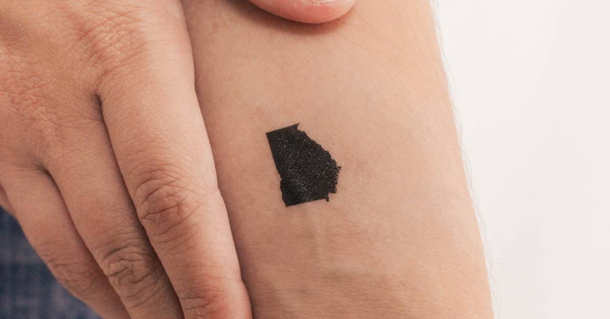 Minimalistic style Georgia map temporary tattoo placed