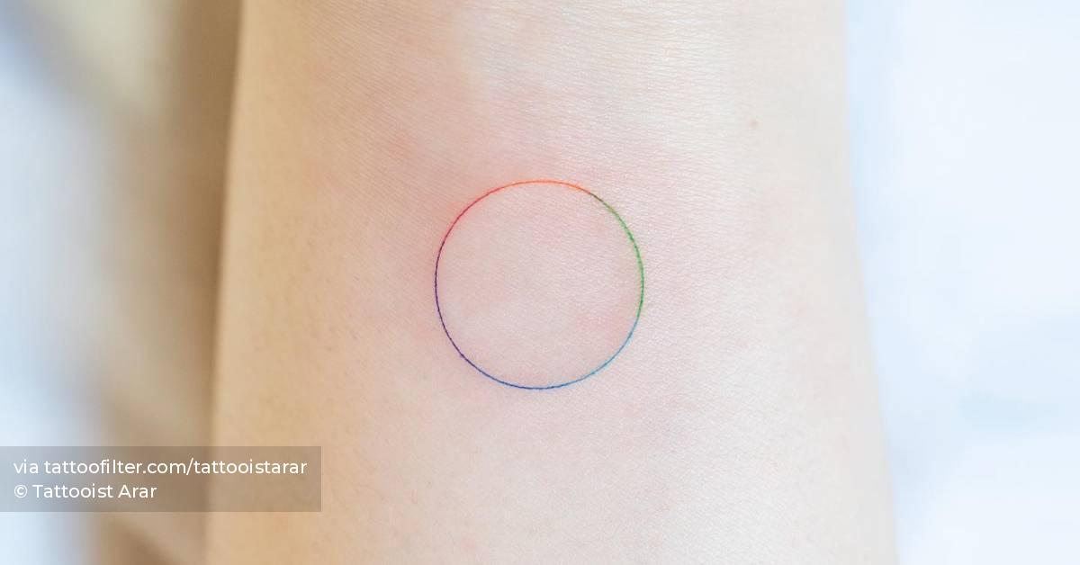 Minimalistic style spectrum circle tattoo located on