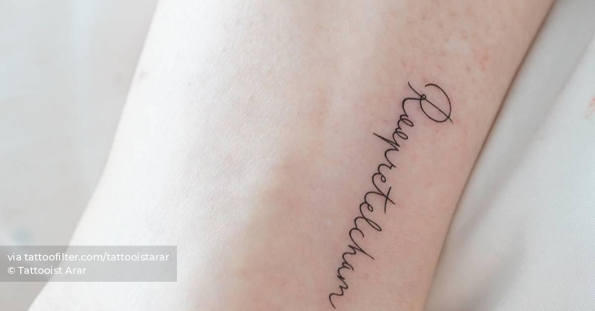 "Roopretelcham" lettering tattoo handwritten on the