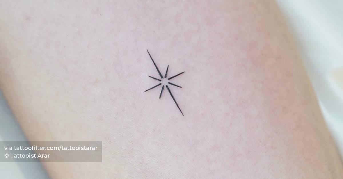 Minimalistic north star tattoo done on the tricep.