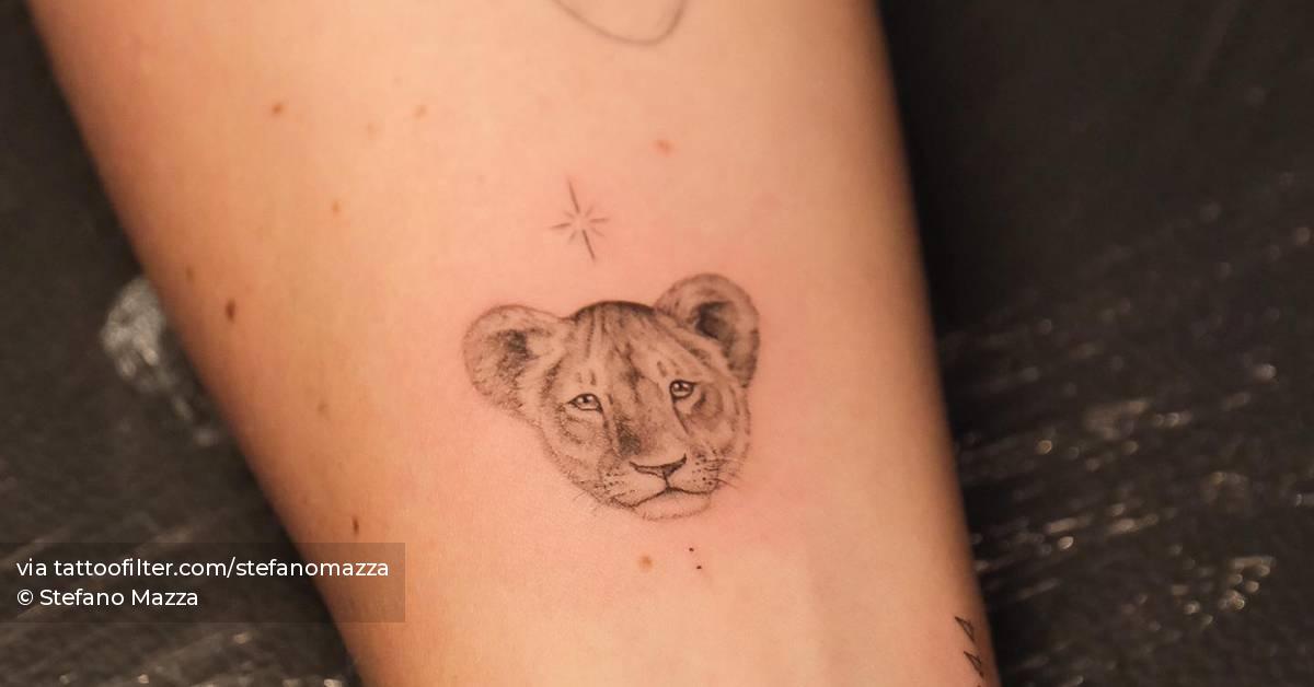 Little lioness portrait tattoo located on the inner