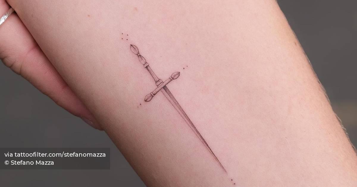 Single needle sword tattoo done on the inner forearm.