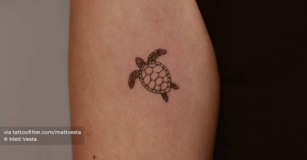 Fine line style turtle tattoo done on the tricep.