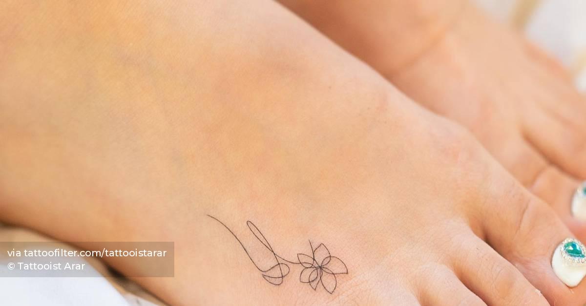 One line flower tattoo located on the foot.