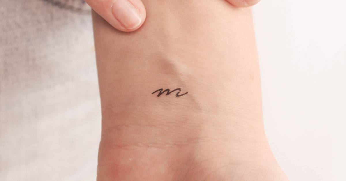 Little lowercase handwritten M letter temporary tattoo