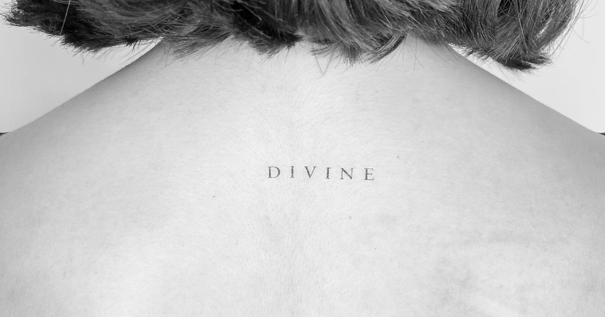 Uppercase serif 'DIVINE' temporary tattoo