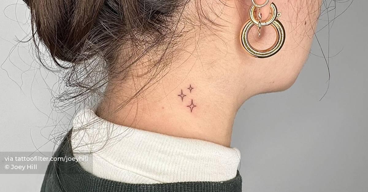 Minimalistic style stars tattooed on the neck.