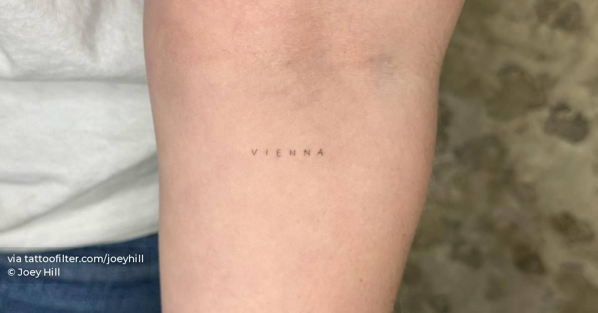 "Vienna" lettering tattoo handwritten on the inner