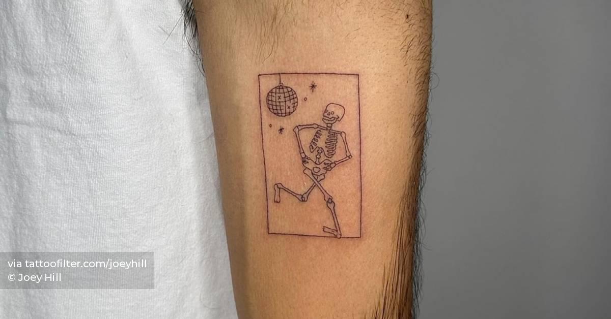 Fine line style dancing skeleton tattoo placed on the