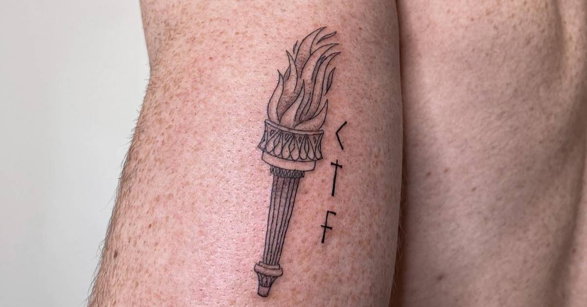 Torch tattoo located on the tricep, done in