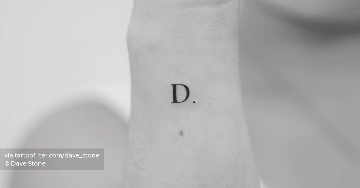 Tattoo of the letter "D" done on the wrist.