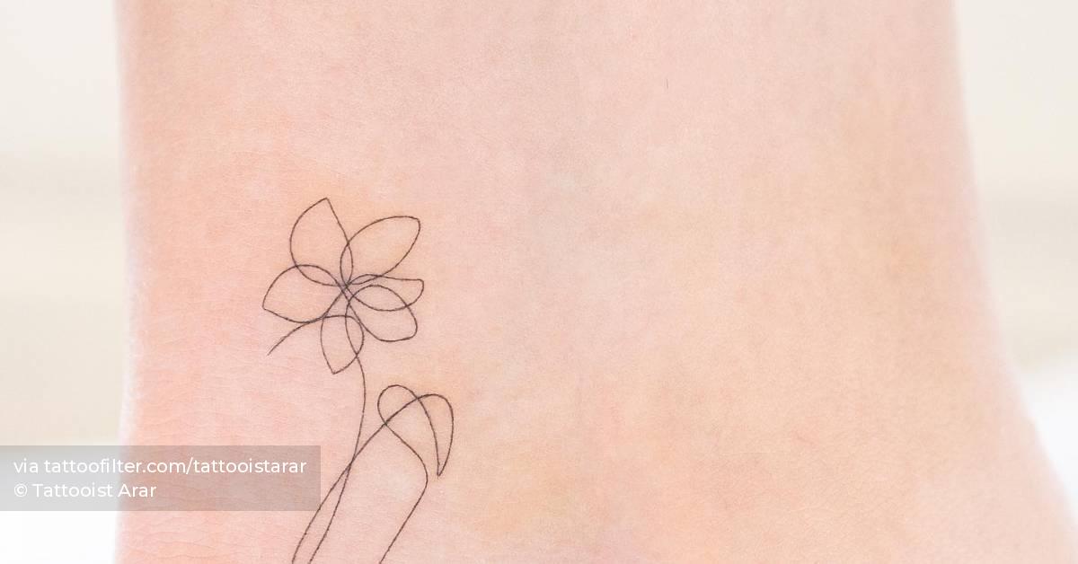 One line flower tattoo placed on the ankle.