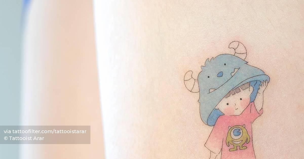 Boo tattoo located on the thigh, cartoon style.