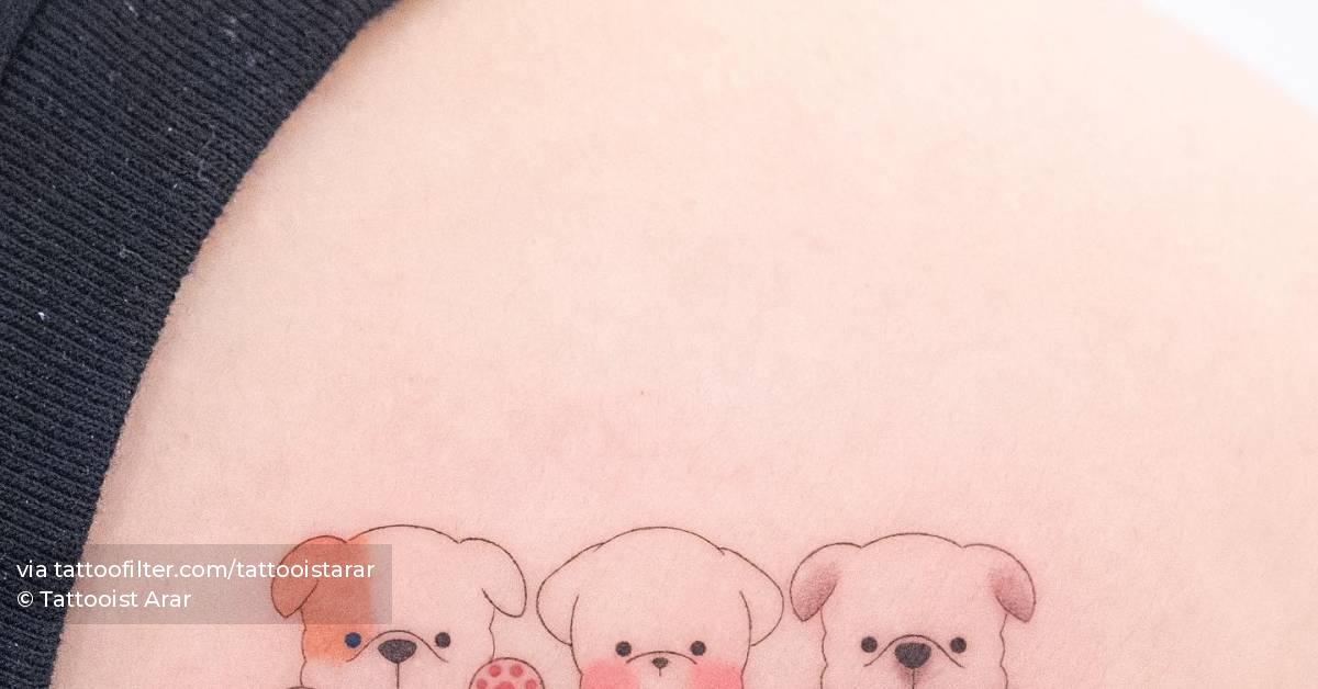 Three dogs tattooed on the shoulder blade, illustrative