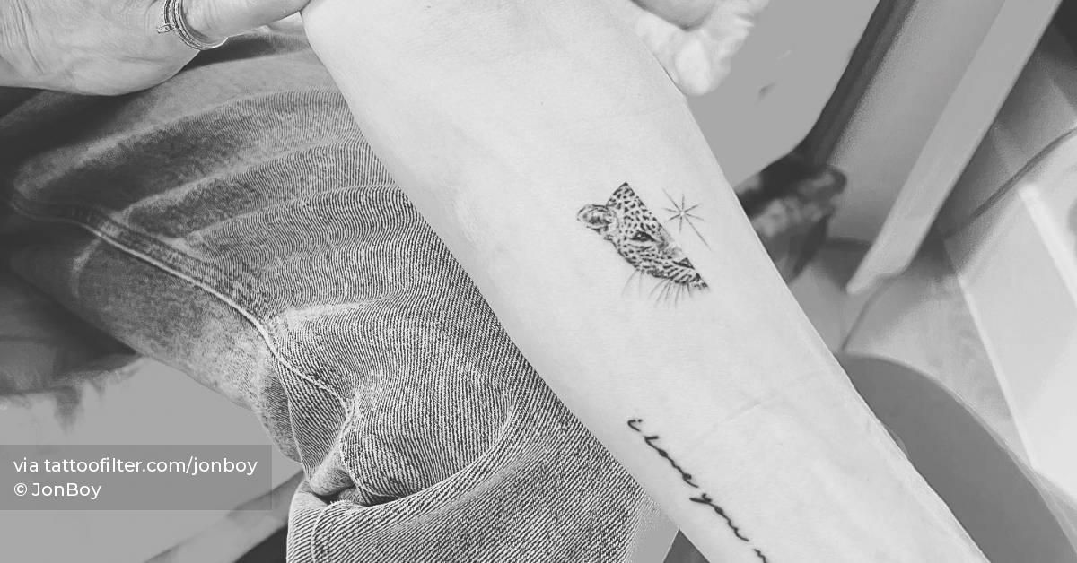 "I love you more" lettering tattoo located on the inner