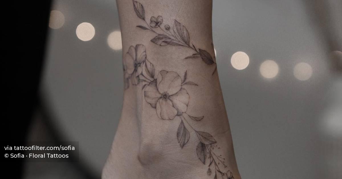 Poppies flower anklet tattoo done in illustrative