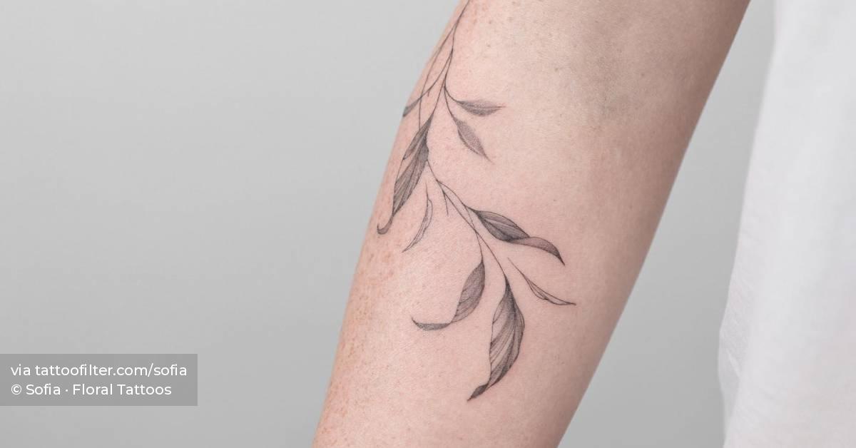 Freehand leaves tattoo located on the inner forearm,