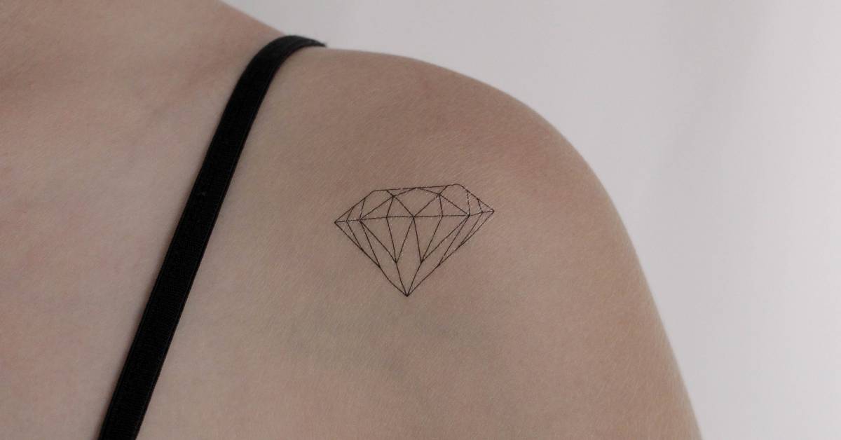 Fine line diamond temporary tattoo located on the
