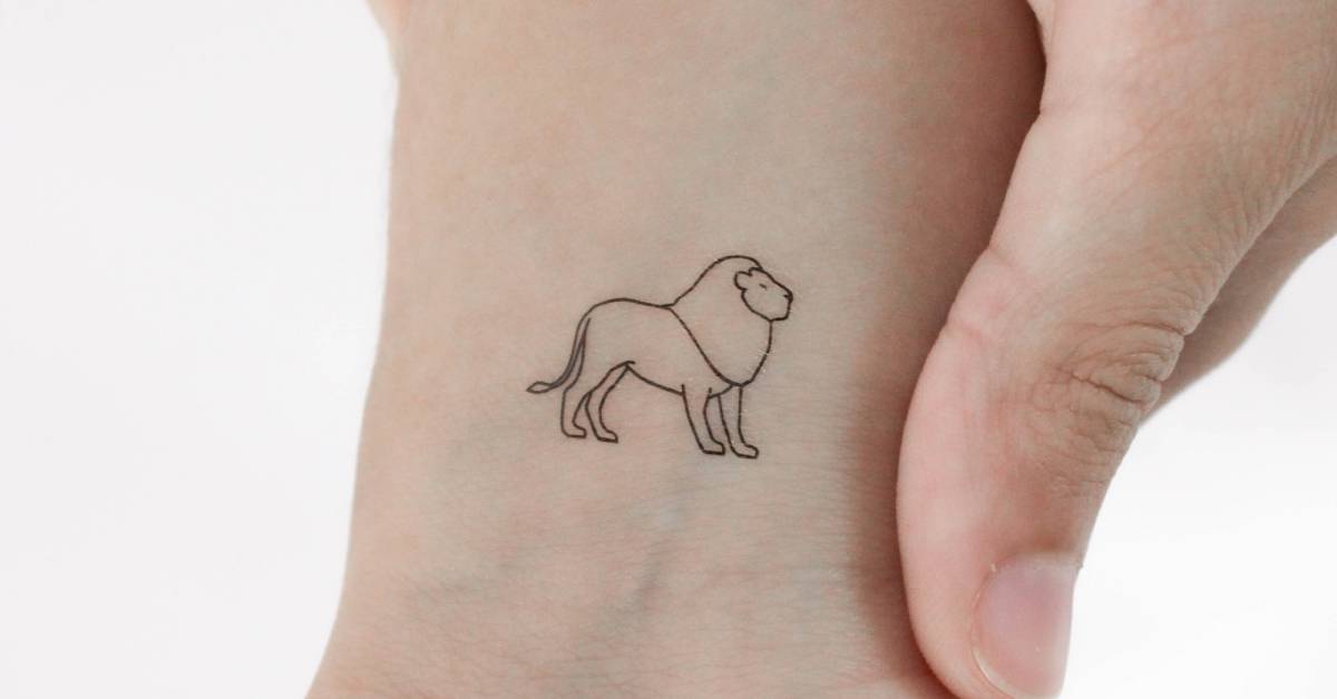 Fine line tiny lion temporary tattoo placed on the