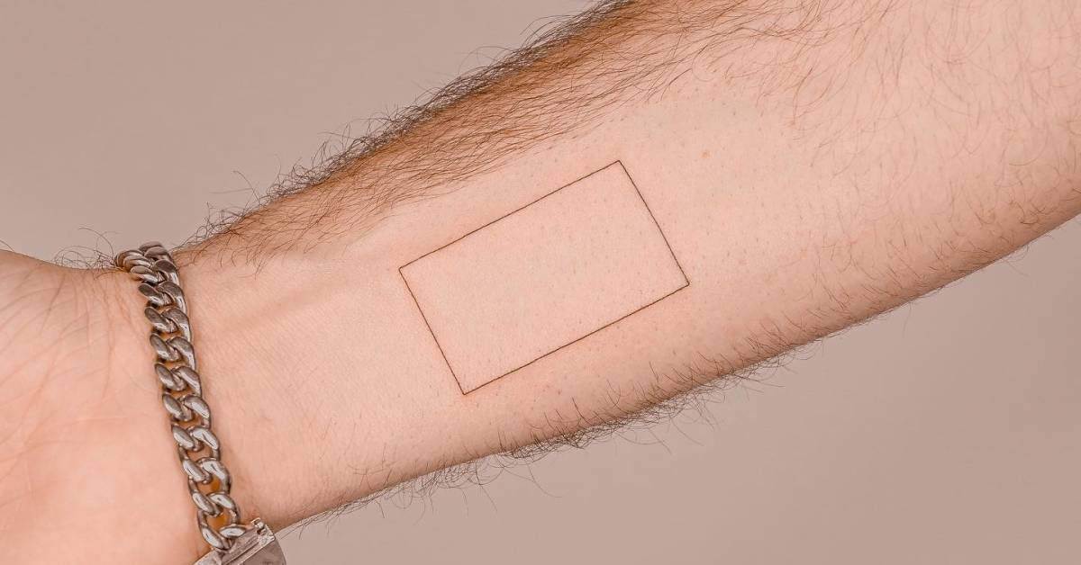 Fine line minimalistic rectangle tattoo placed on the
