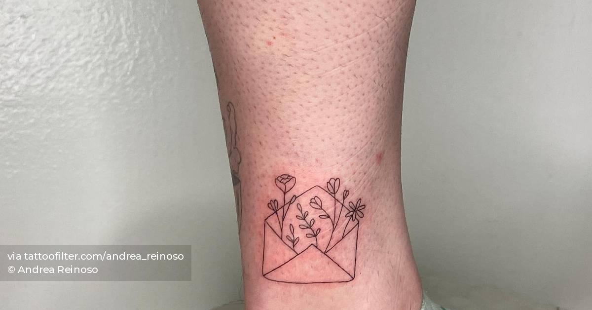 Fine line style floral envelope tattooed on the ankle.