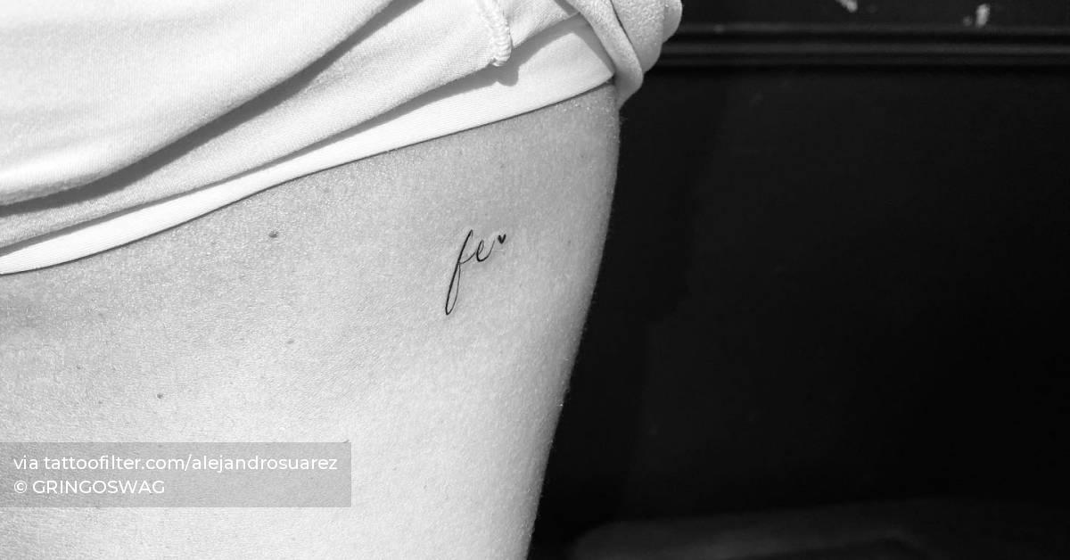 Tattoo of the word "fe" located on the rib.