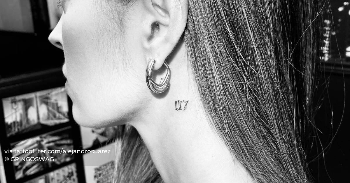 Tattoo of the number "07" located on the neck.