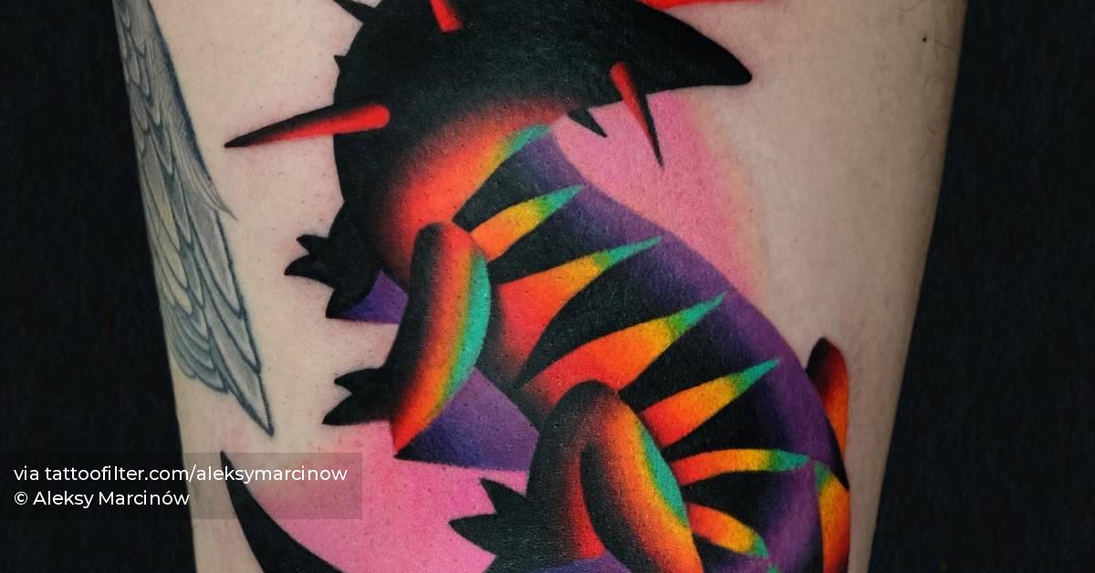 Colorful salamander tattoo placed on the thigh.